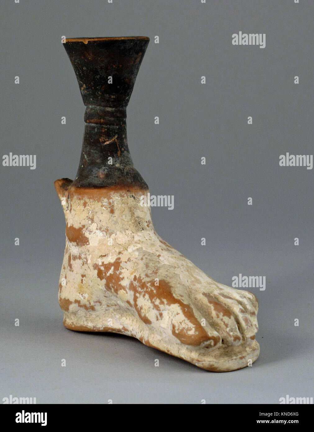 This ancient Greek foot-shaped aryballos was used to hold oil or ...