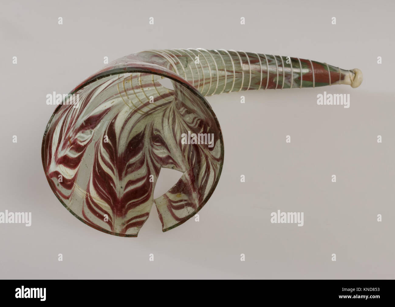 A Langobardic glass drinking horn from 575–625 CE, displaying intricate ...