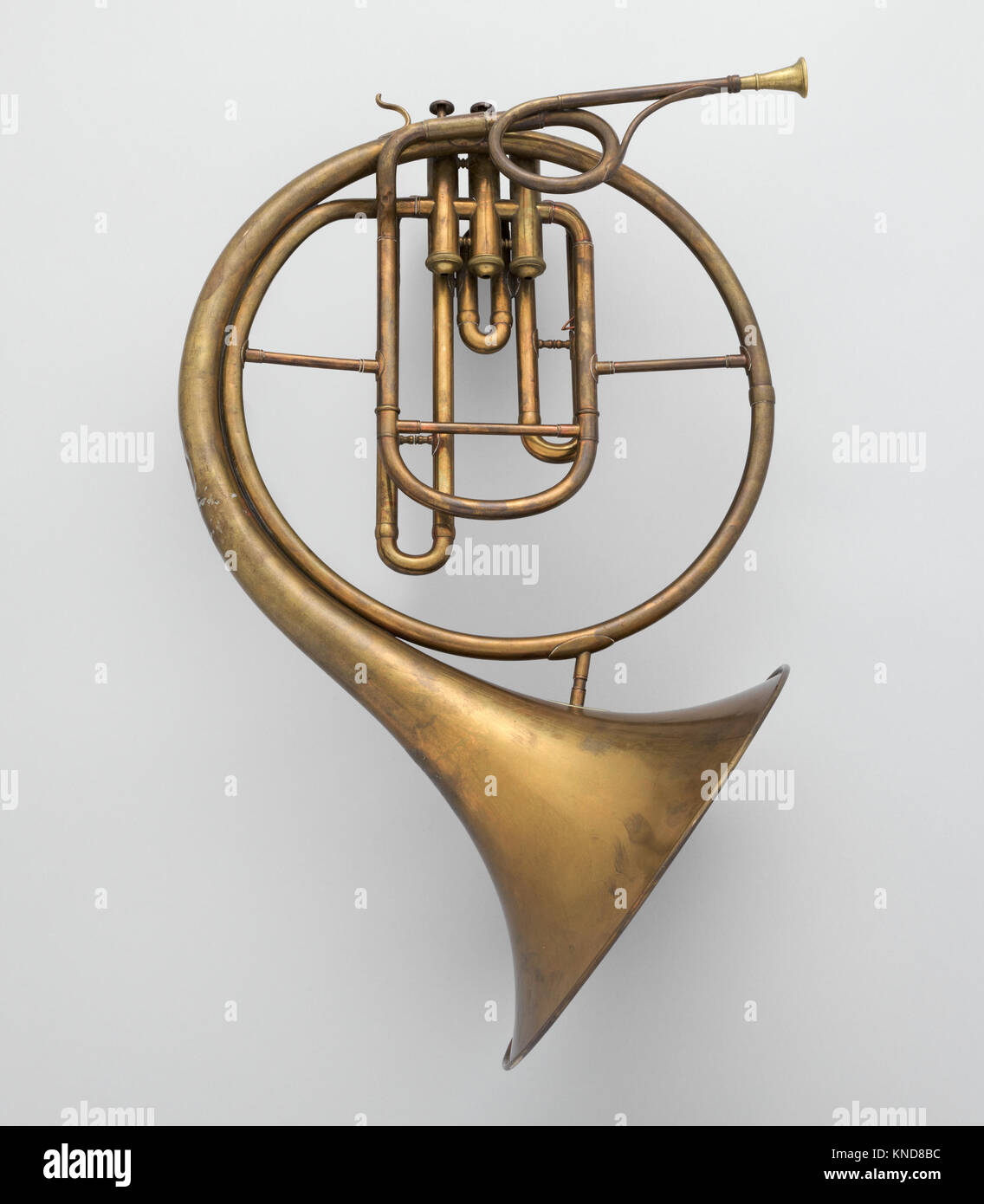 This French horn, cataloged under MET DP-12679-062, is a brass musical ...