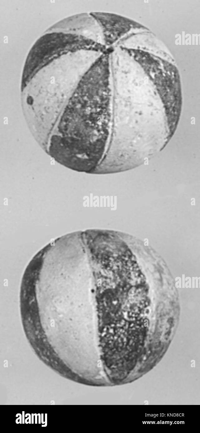 This small, spherical ball bead, made from glass or stone, exemplifies ...