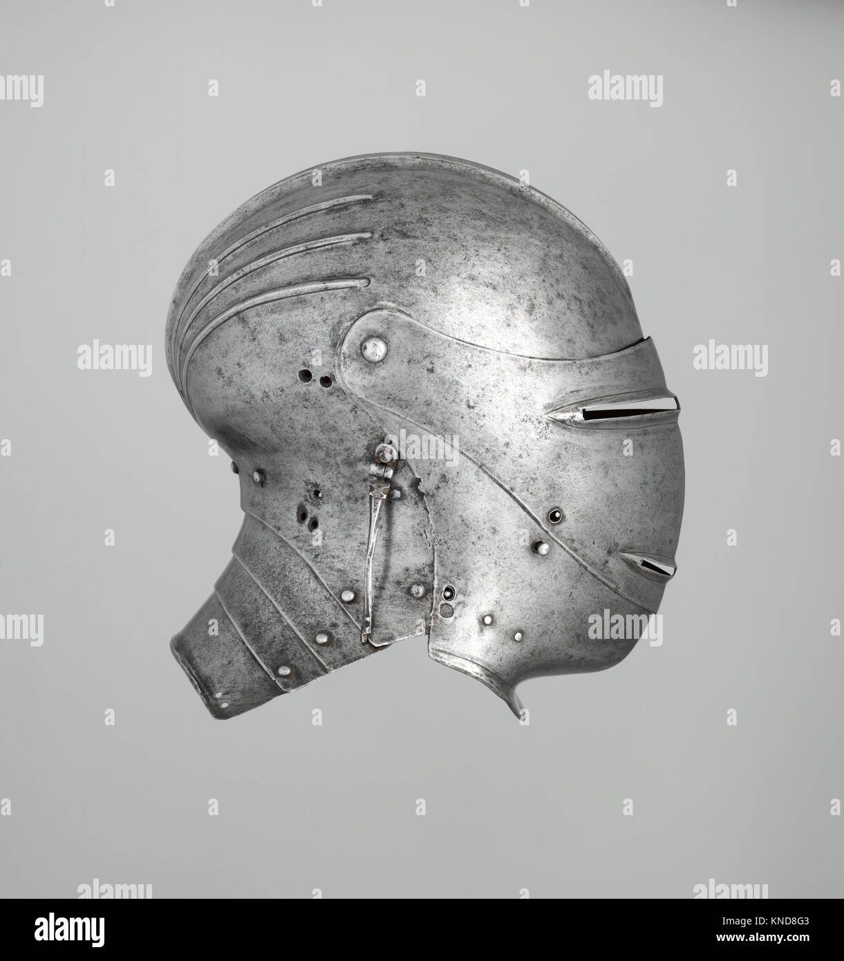 This close helmet, part of a medieval European armor suit, has a hinged ...