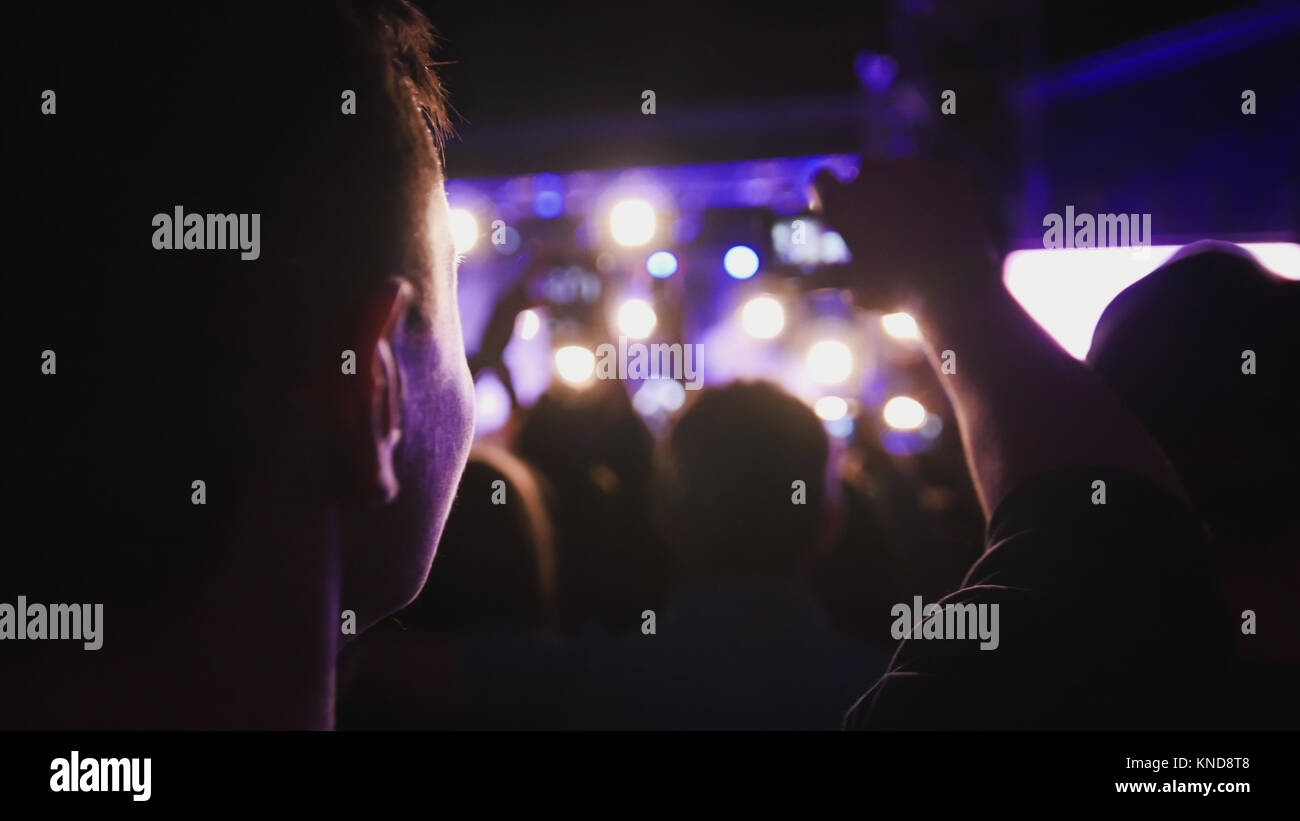 Cheering dancing people crowd at rock concert Stock Photo - Alamy