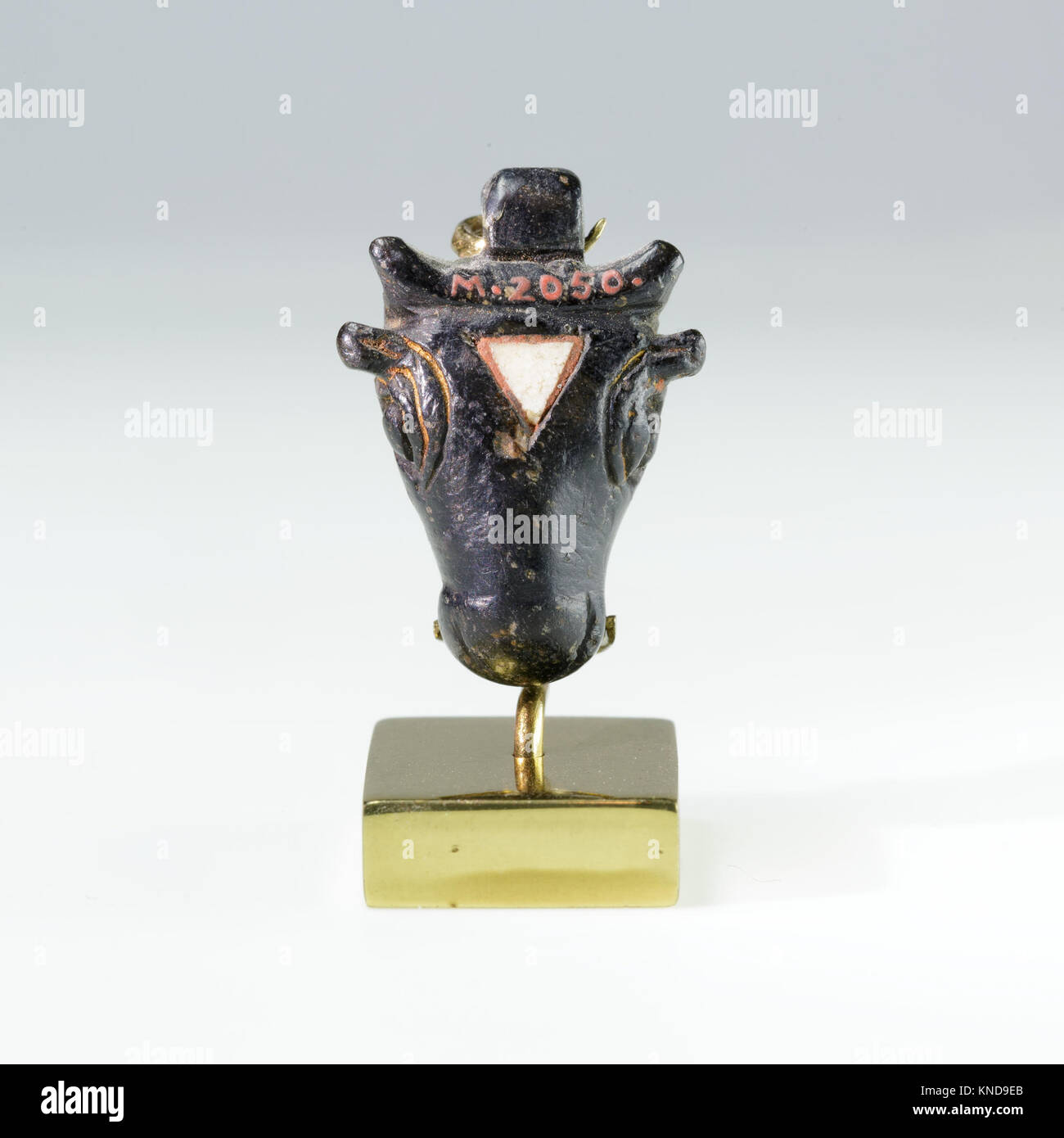 This amulet features the head of an Apis bull, a sacred animal in ...