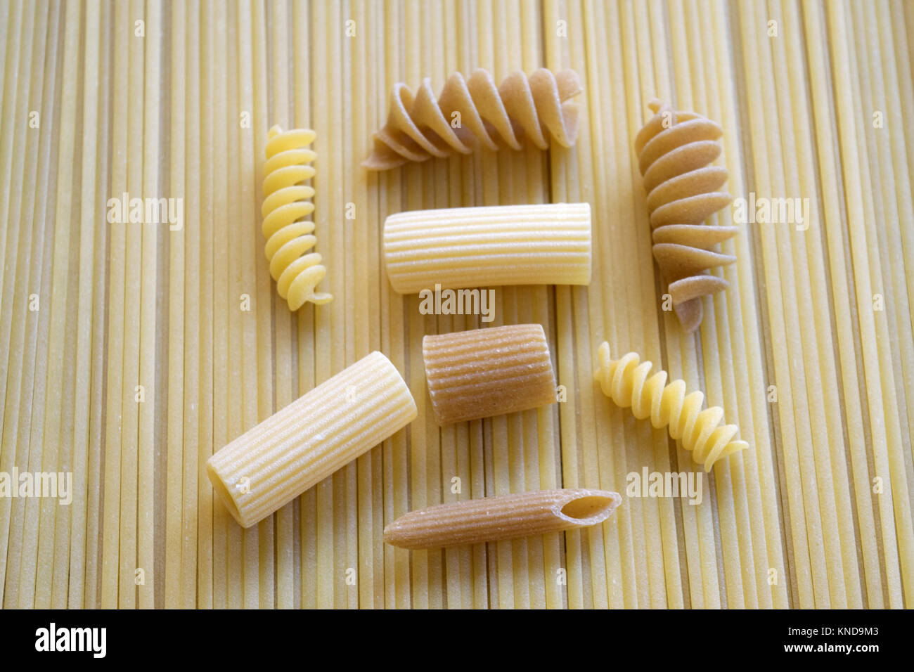 assortment of of pasta various of a background of spaghetti Stock Photo ...