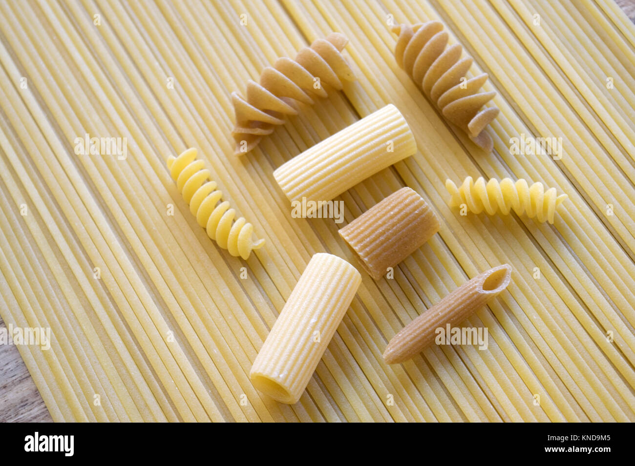 assortment of of pasta various of a background of spaghetti Stock Photo ...
