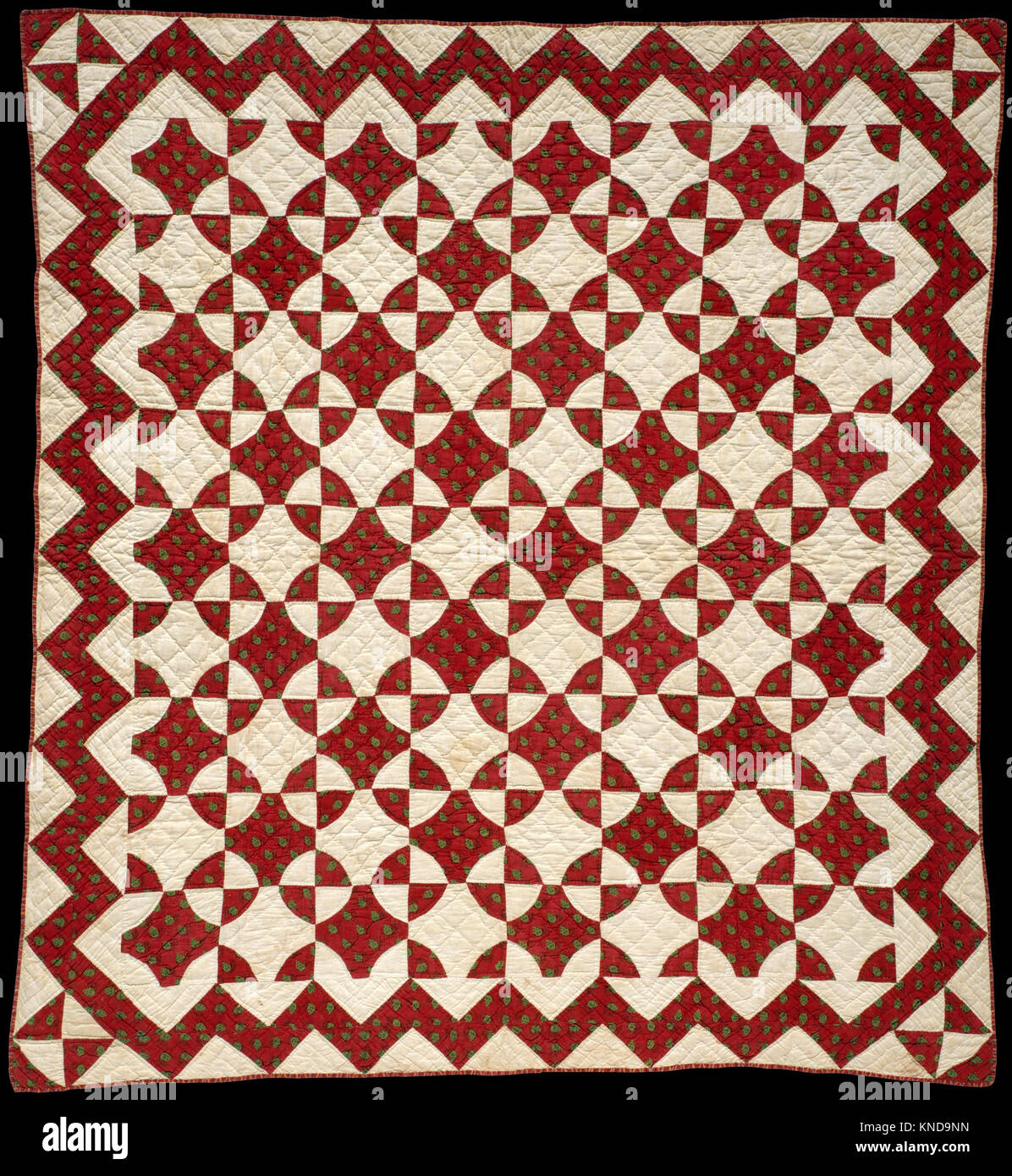 A crib quilt featuring the Mill Wheel pattern from the MET collection ...