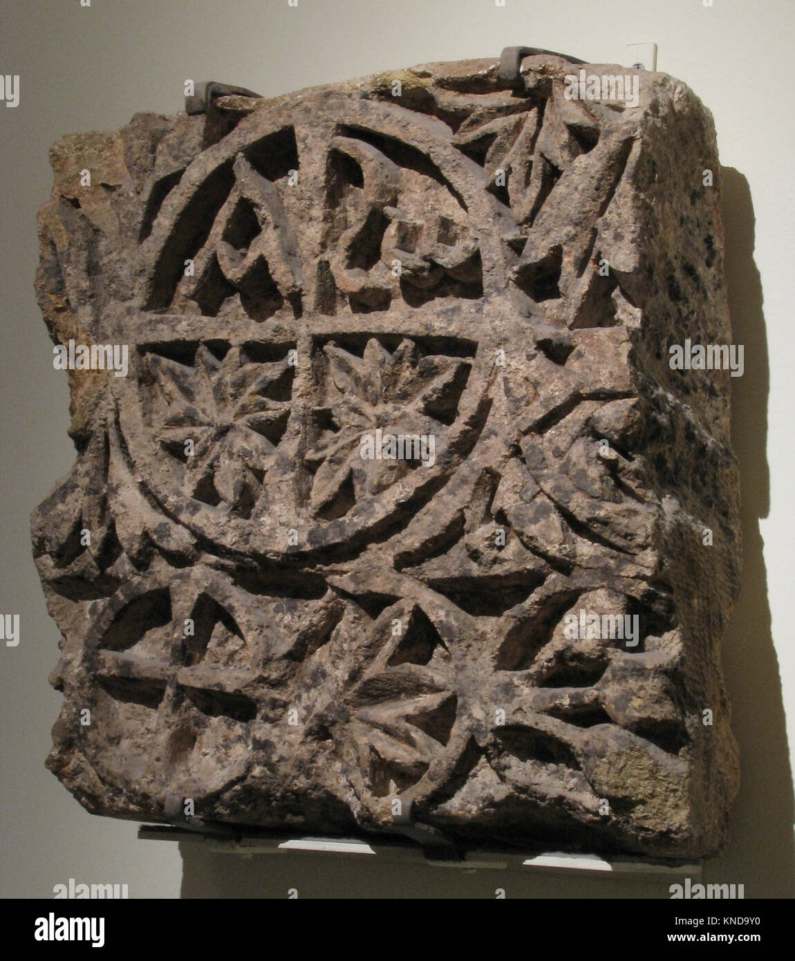 This lintel fragment shows detailed architectural carving, illustrating ...