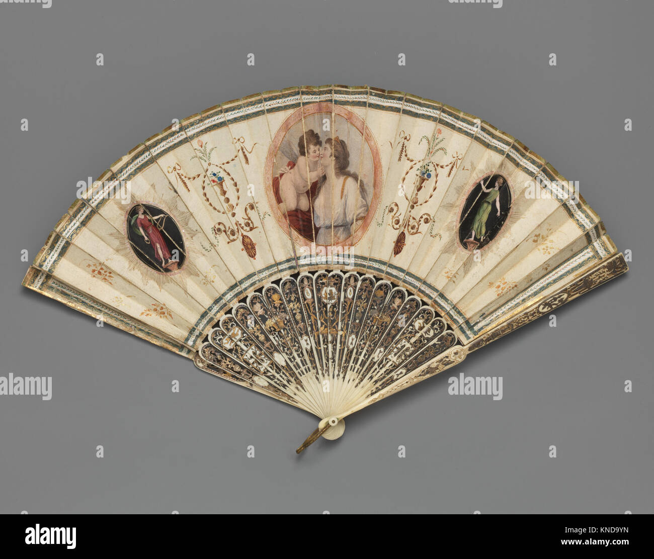 This fan, crafted from delicate materials, serves both as a functional ...