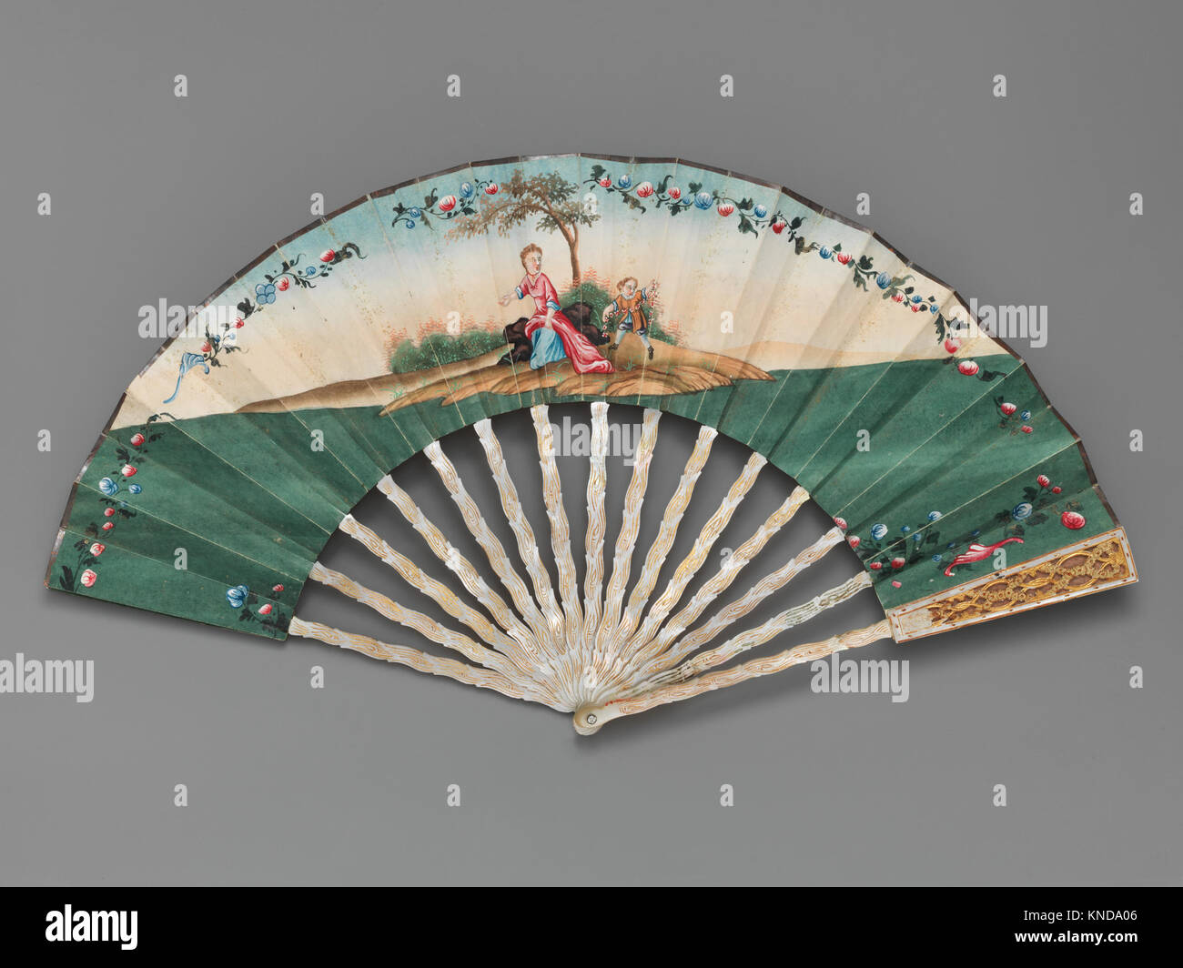 This fan features a decorative design, showcasing intricate patterns ...