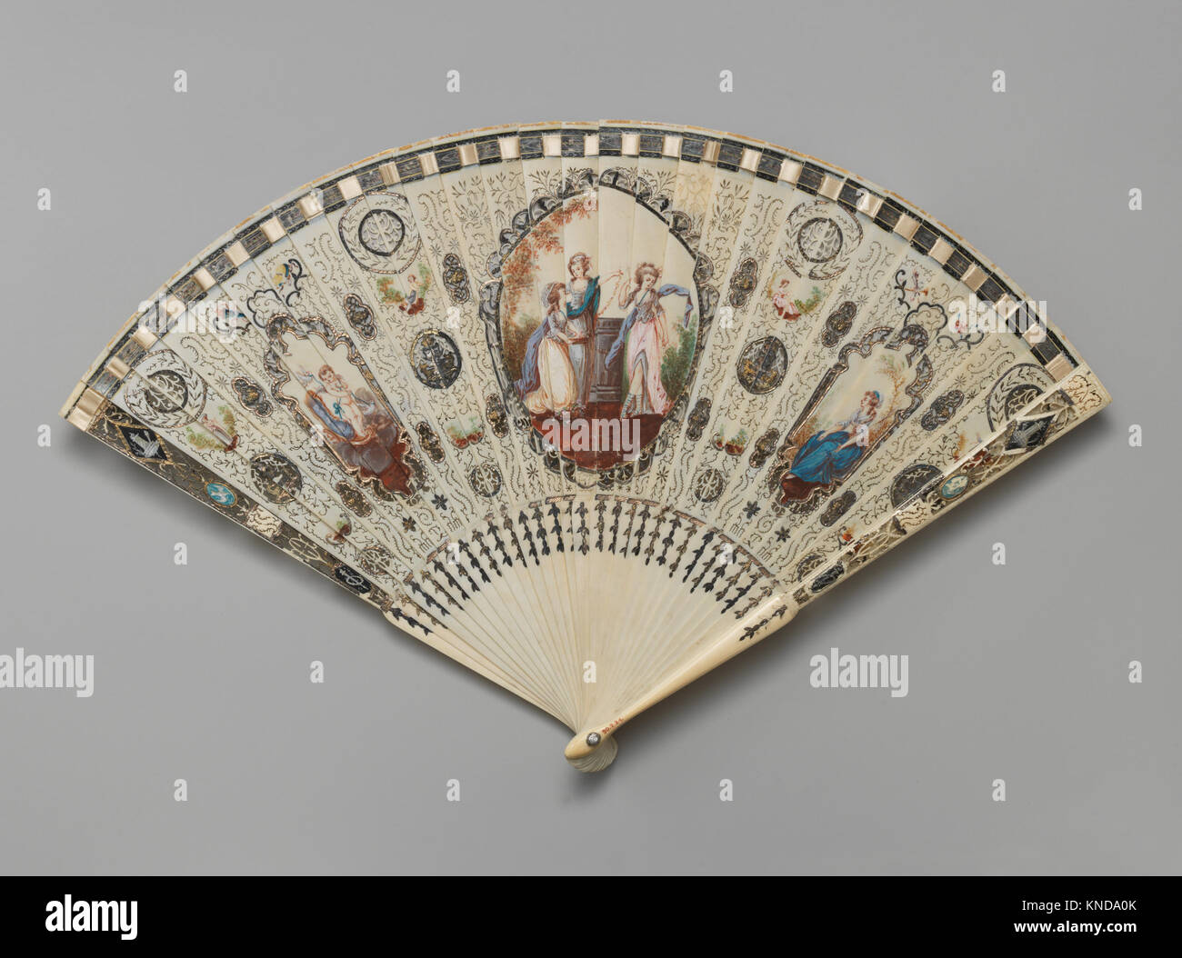 This fan features a delicate design, combining intricate artwork with ...
