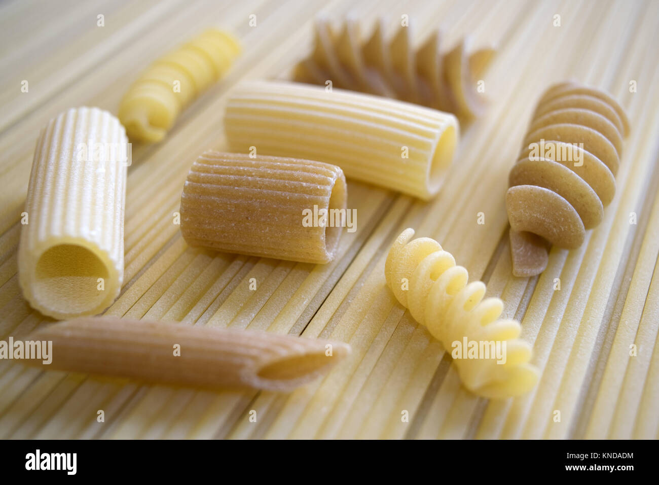 assortment of of pasta various of a background of spaghetti Stock Photo ...