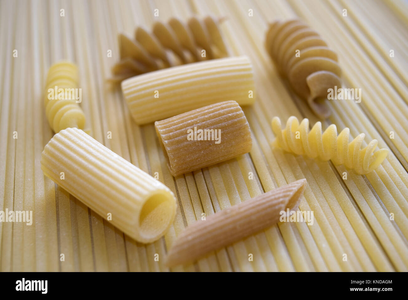 assortment of of pasta various of a background of spaghetti Stock Photo ...