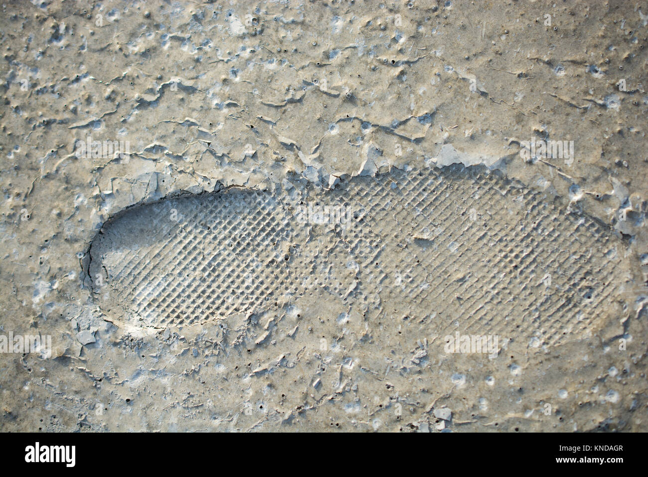 Footstep pattern seen on a concrete background Stock Photo - Alamy