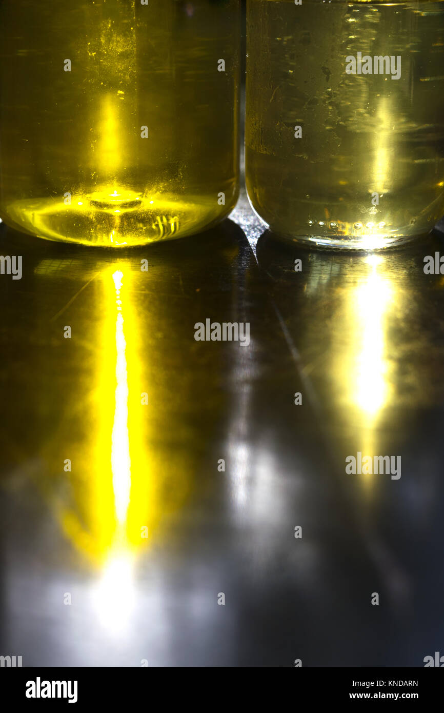 plays of colors with oil bottles and its reflections Stock Photo - Alamy