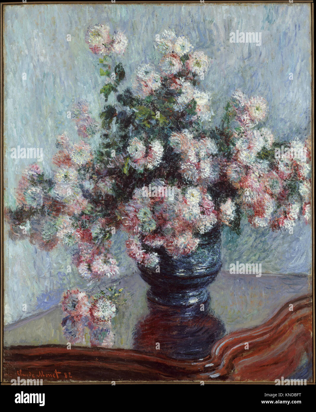 This 1882 oil painting 'Chrysanthemums' by Claude Monet depicts flowers ...