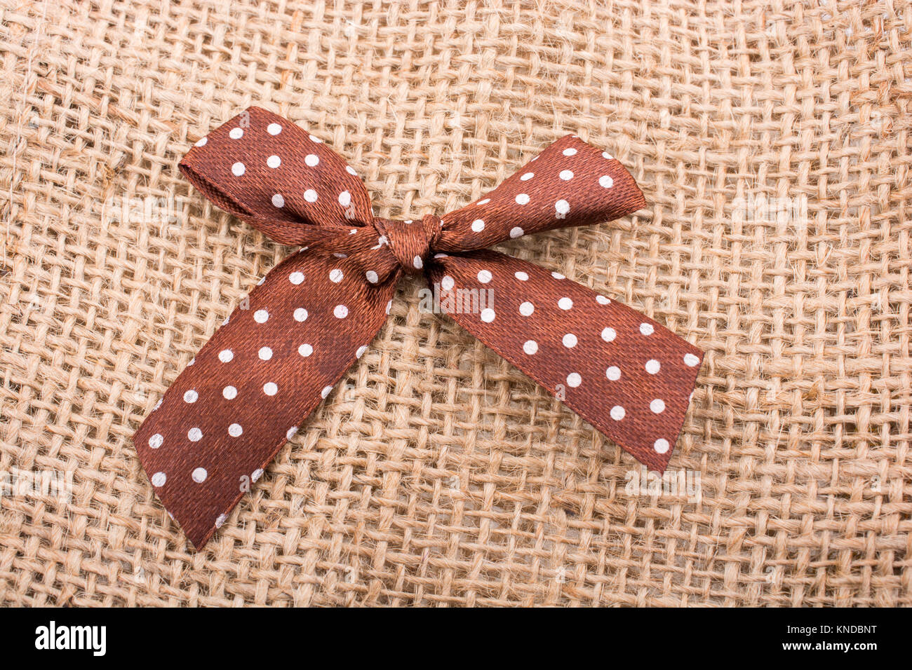 Brown color ribbon onbrown linen canvas Stock Photo - Alamy