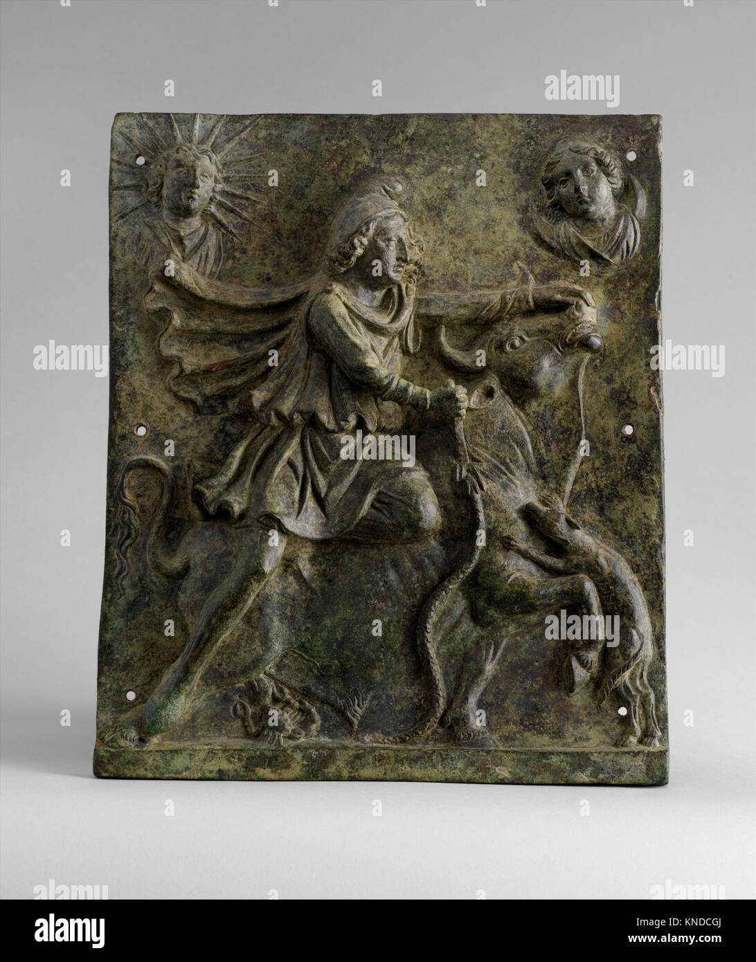 This bronze plaque depicts the mythological scene of Mithras slaying ...