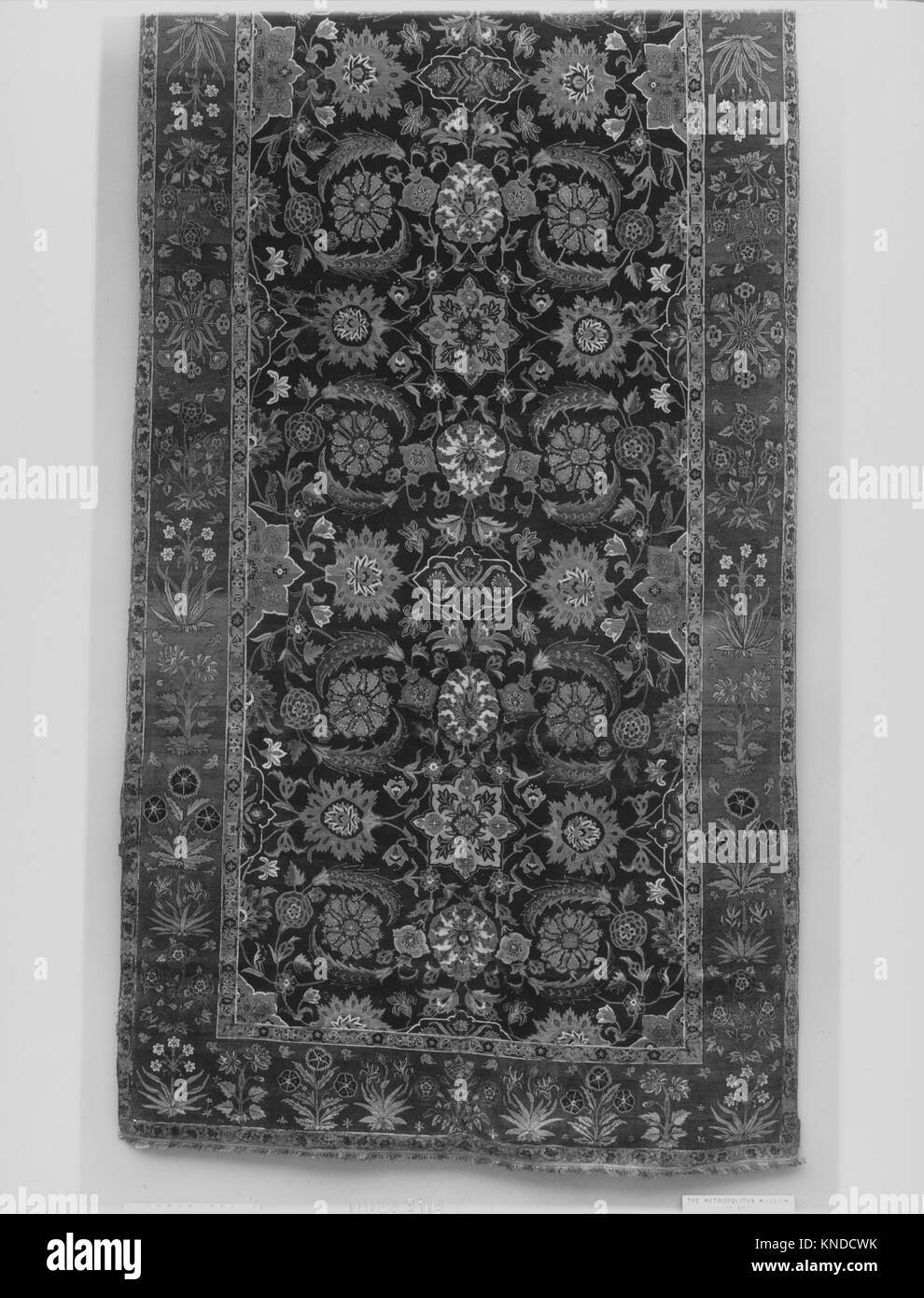 This carpet features an intricate design of scrolling vines and ...