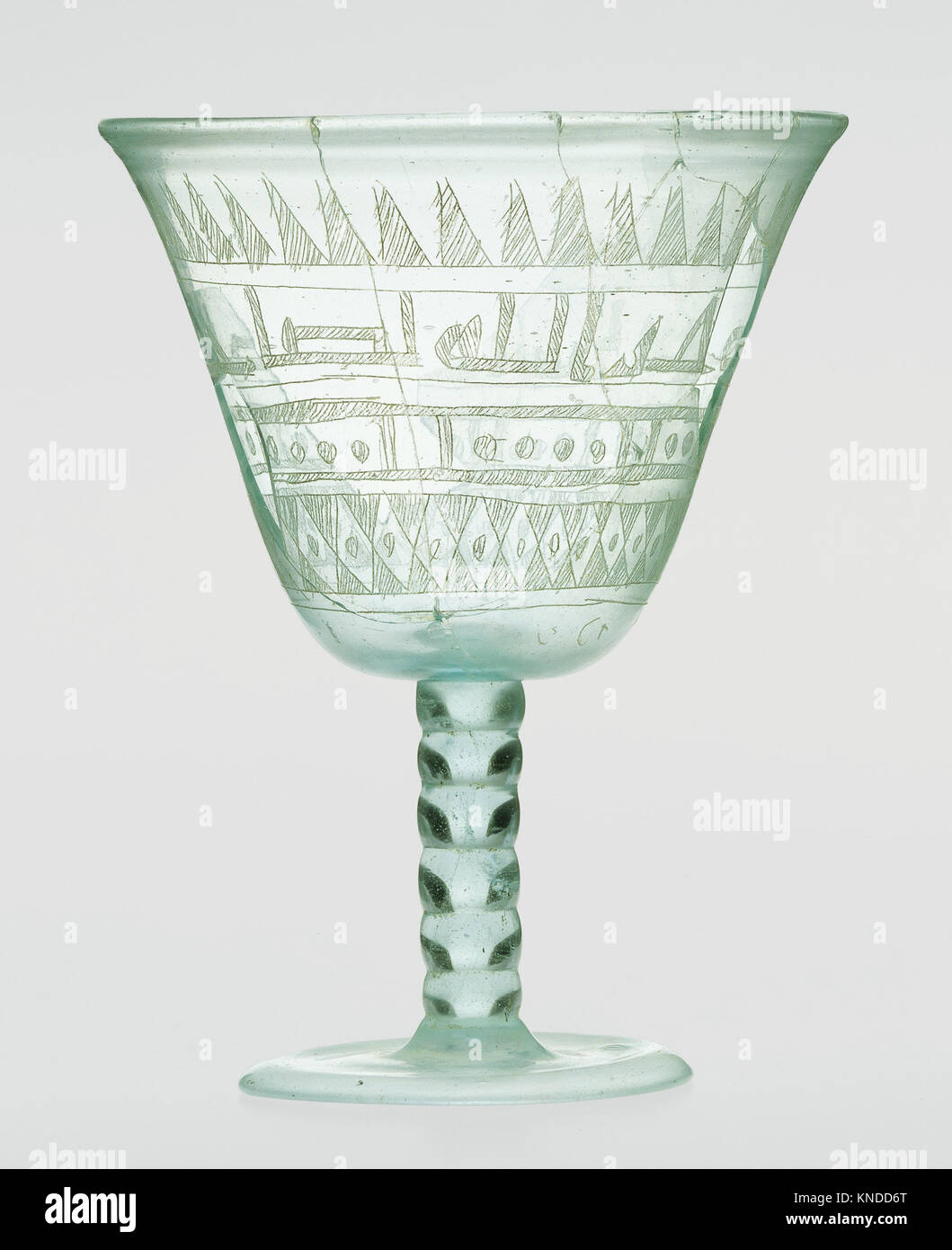 This goblet with incised designs demonstrates fine craftsmanship, used ...