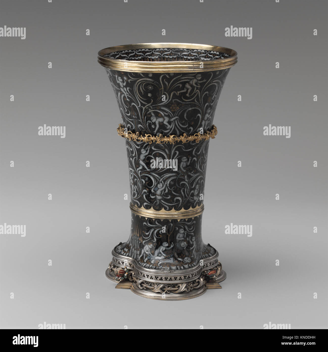 This beaker, featuring depictions of apes, is an example of intricate ...