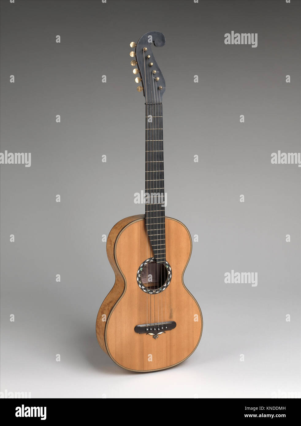 This guitar is an example of historical stringed musical instruments ...