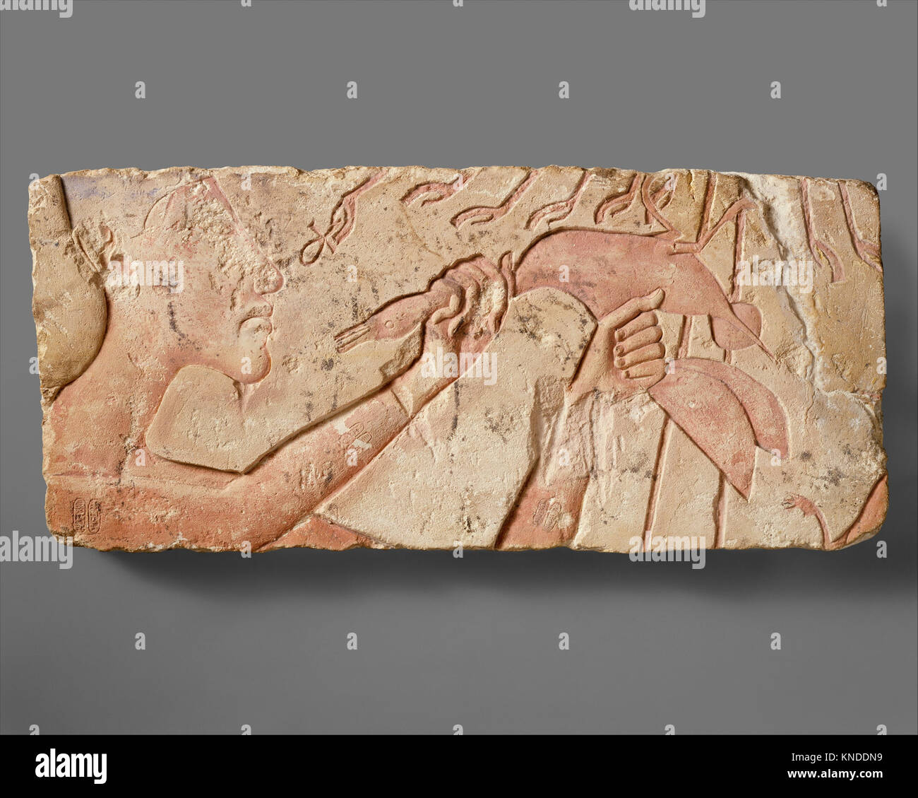 A depiction of Akhenaten, the Egyptian pharaoh, shown in a scene where ...