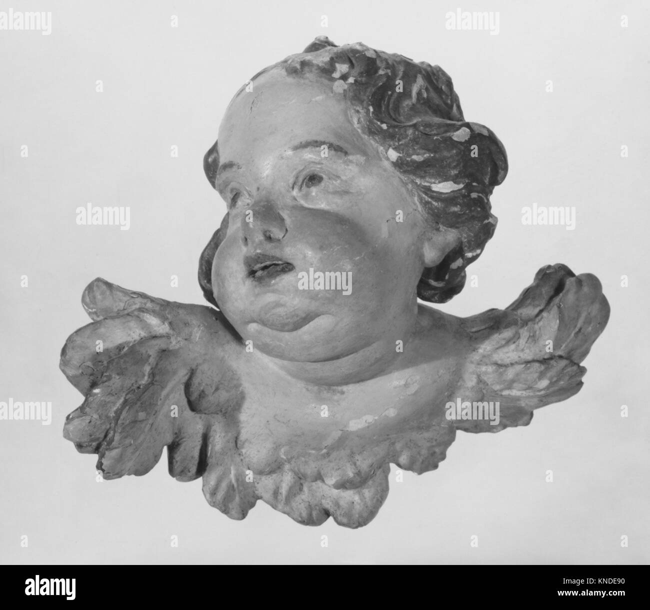 This sculpture, 'Head of a Cherub,' depicts an angelic figure with ...