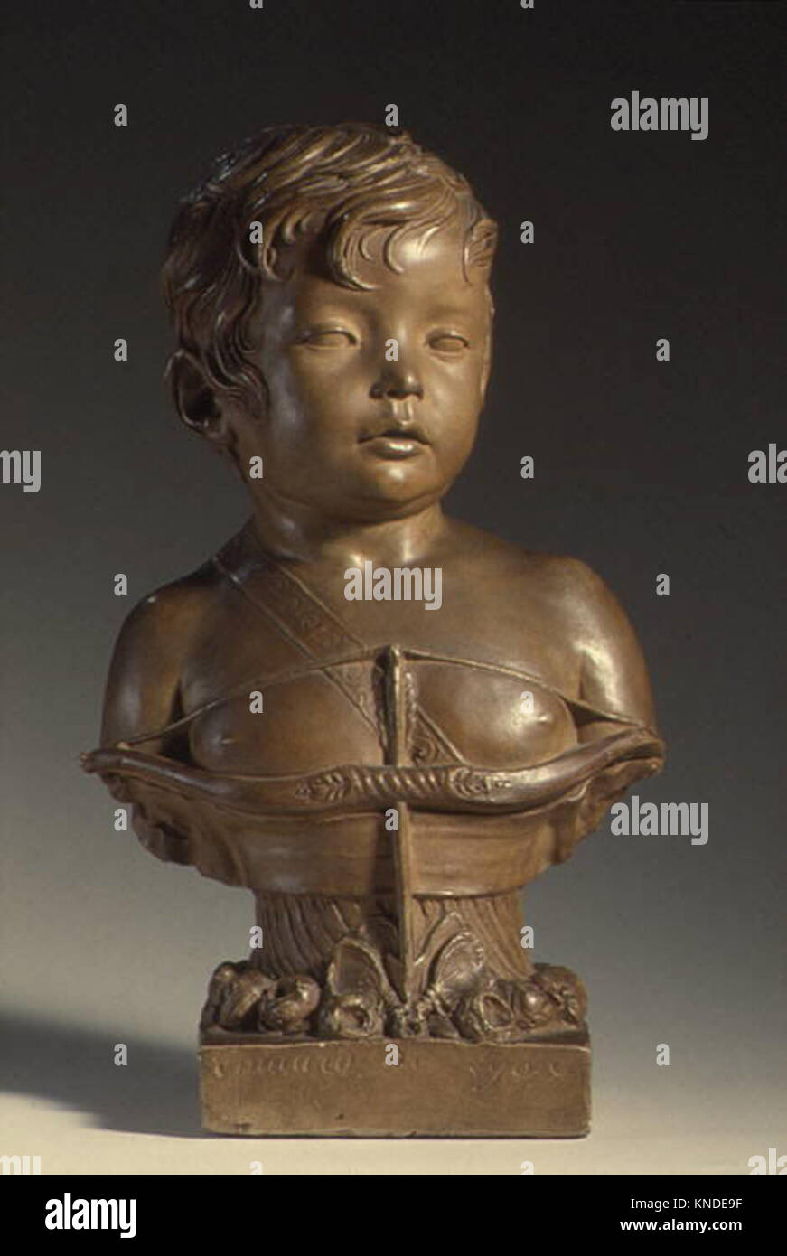 This sculpture, titled 'Boy as Cupid,' depicts a youthful figure ...