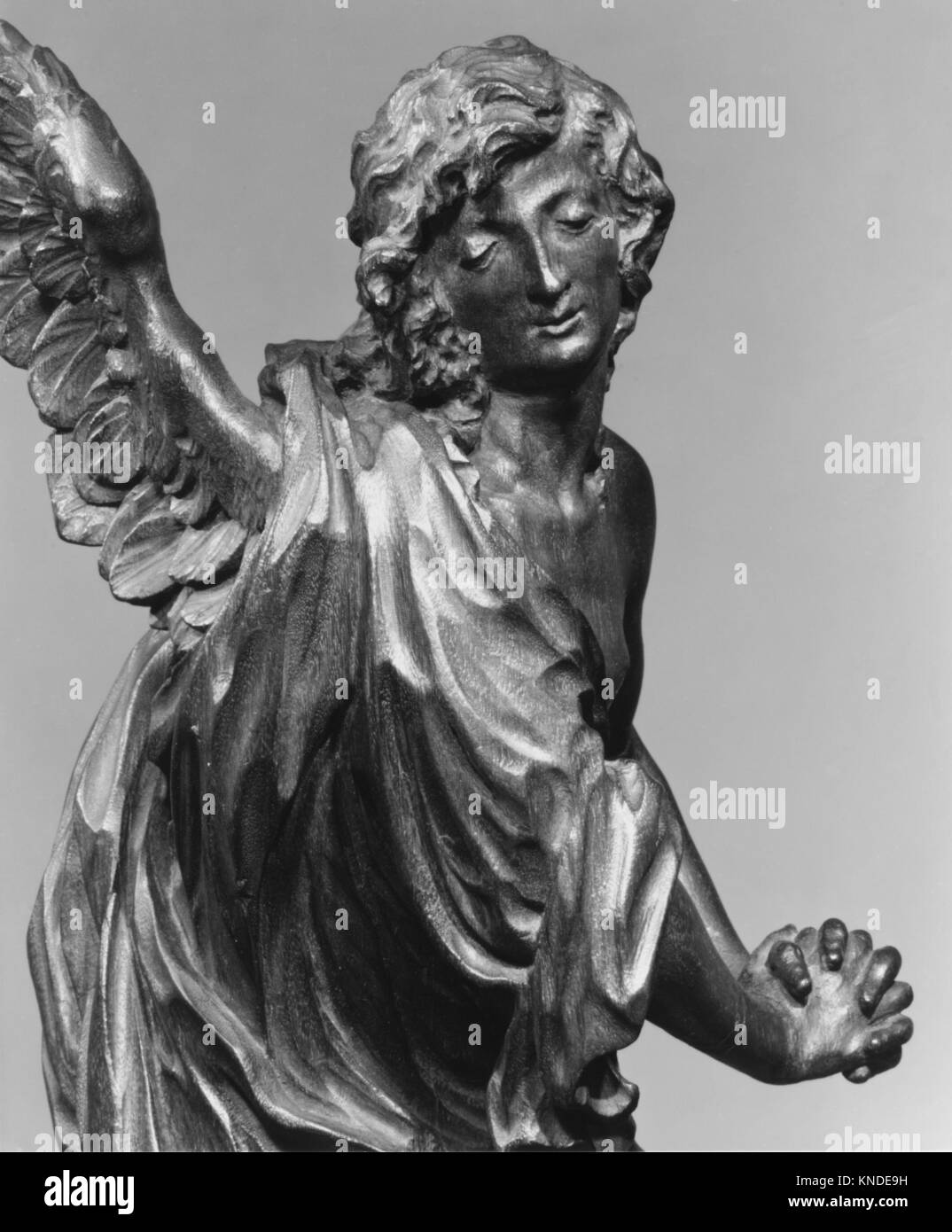 This angel figure, part of a pair, exemplifies classical religious art ...