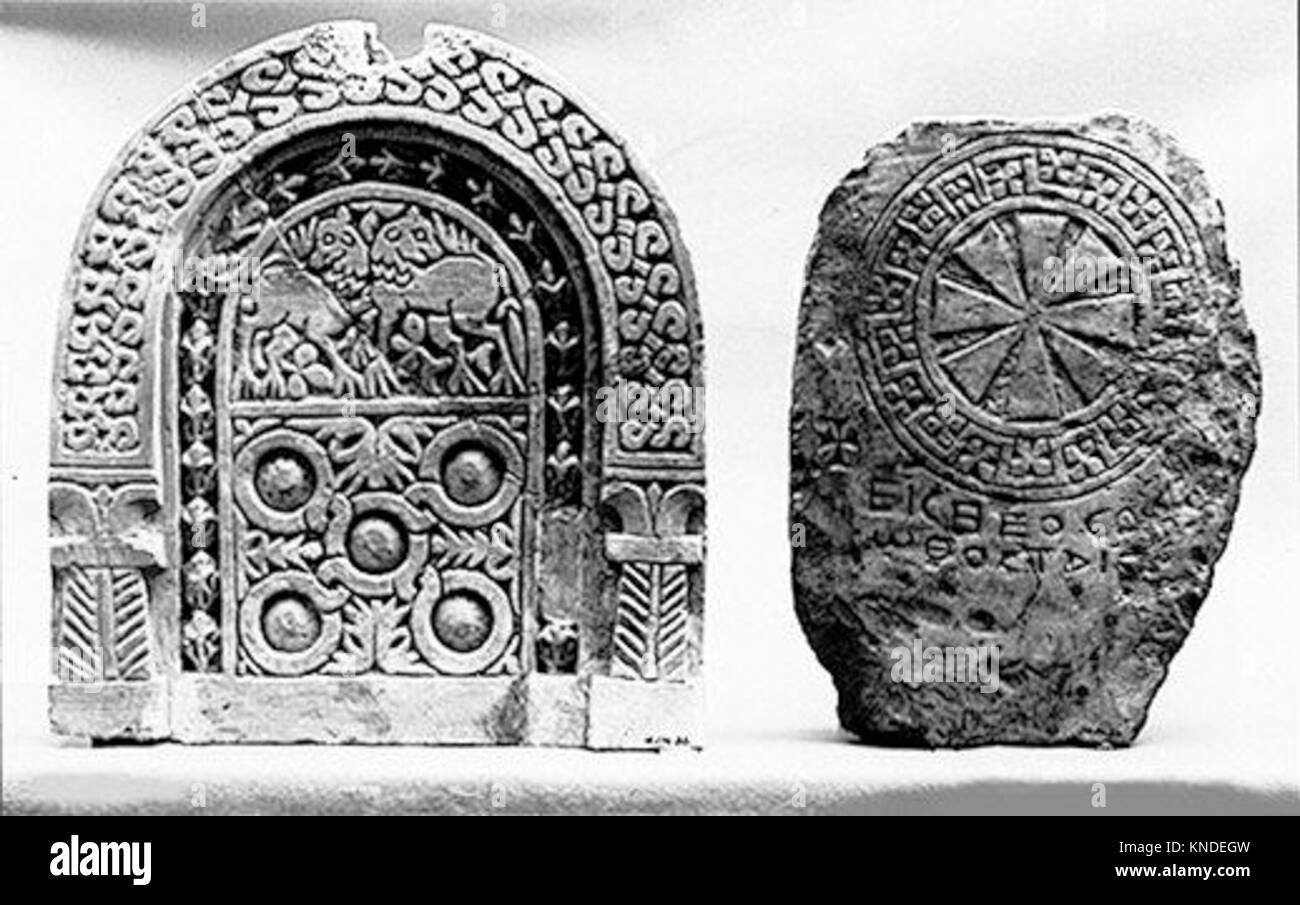 This funerary stele features two lion figures flanking a circular ...