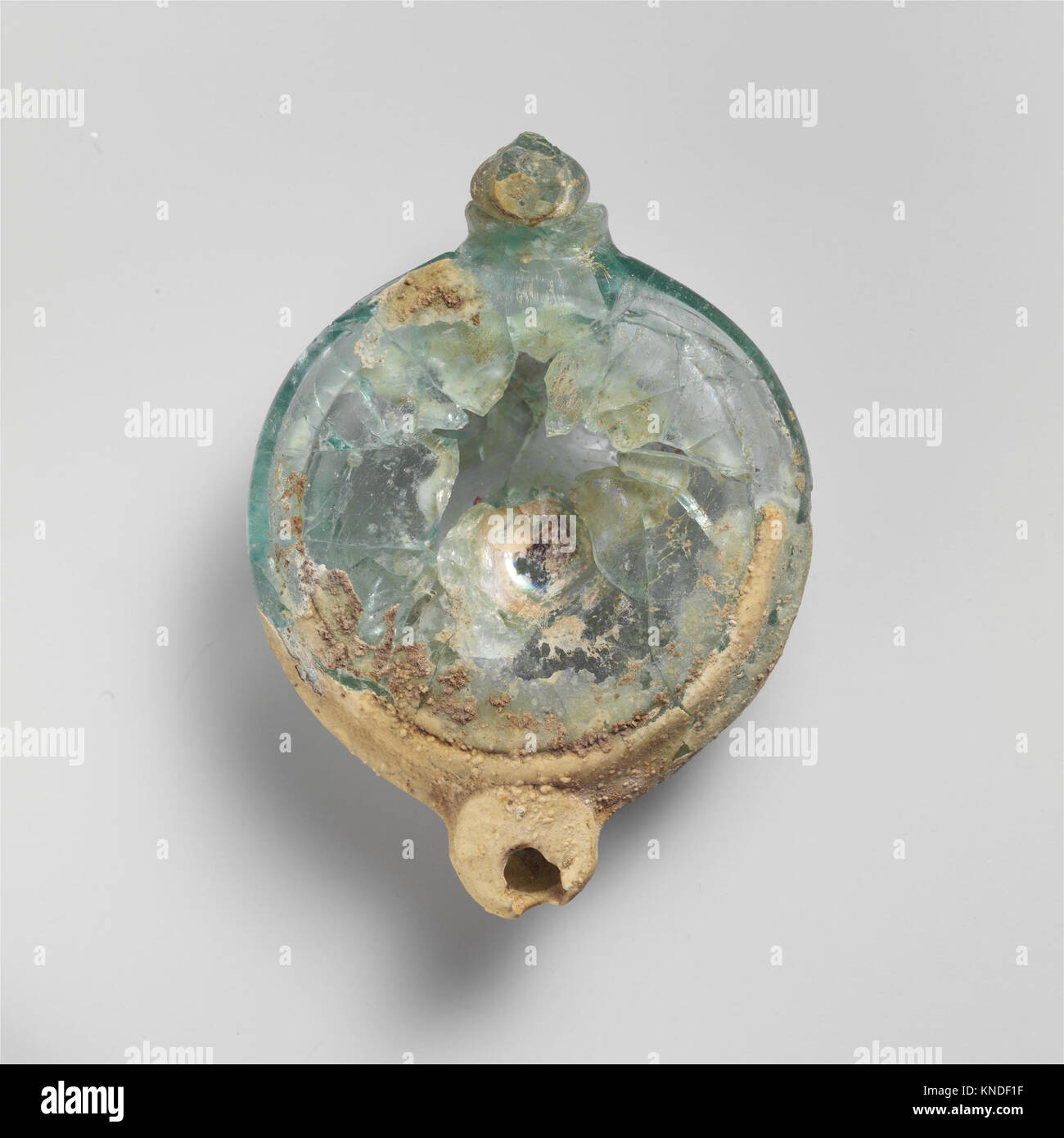 This ancient glass oil lamp represents an important historical object ...