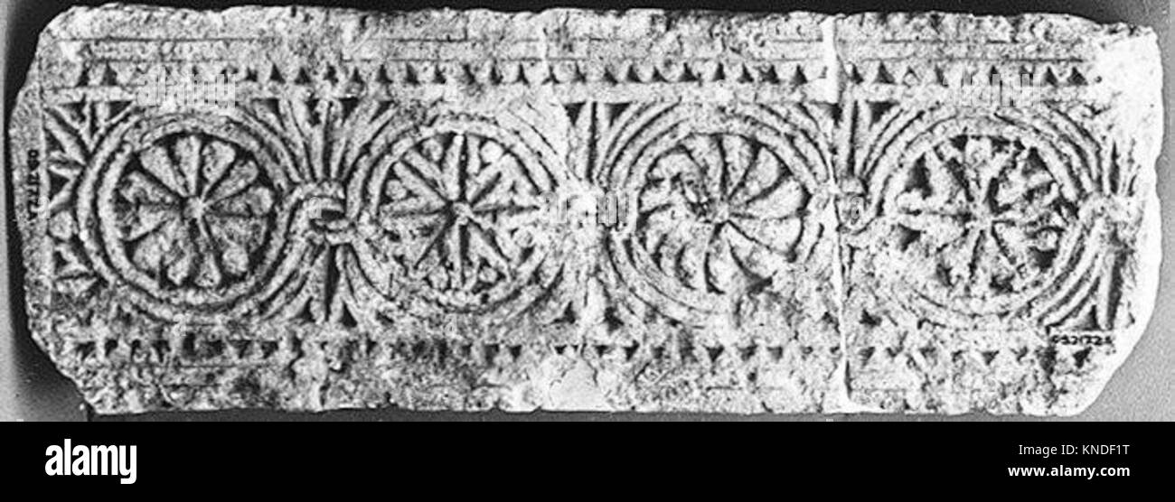 This fragment of a frieze features a portion of architectural ...