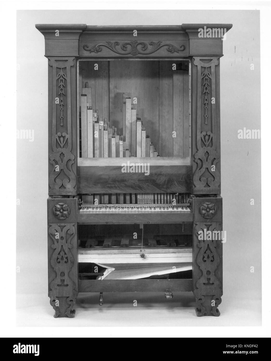 This chamber organ is a period musical instrument that displays ...