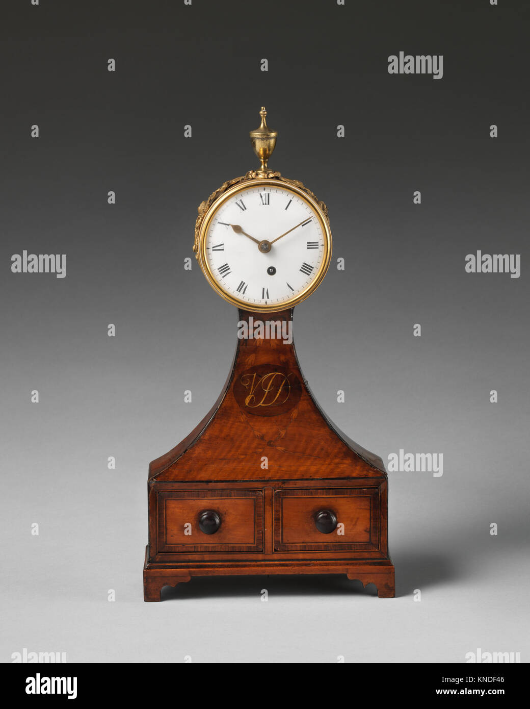 This balloon bracket clock, with its distinctive design, combines both ...