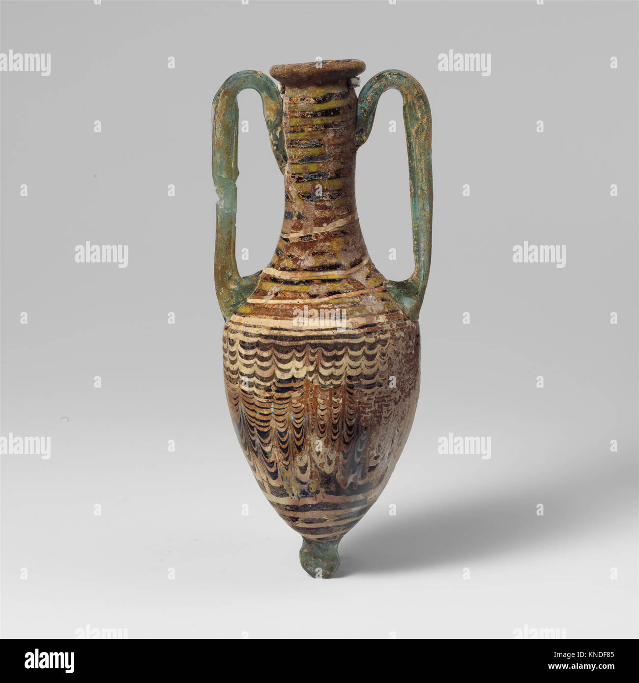 This small glass amphoriskos, used for holding perfume, is a delicate ...