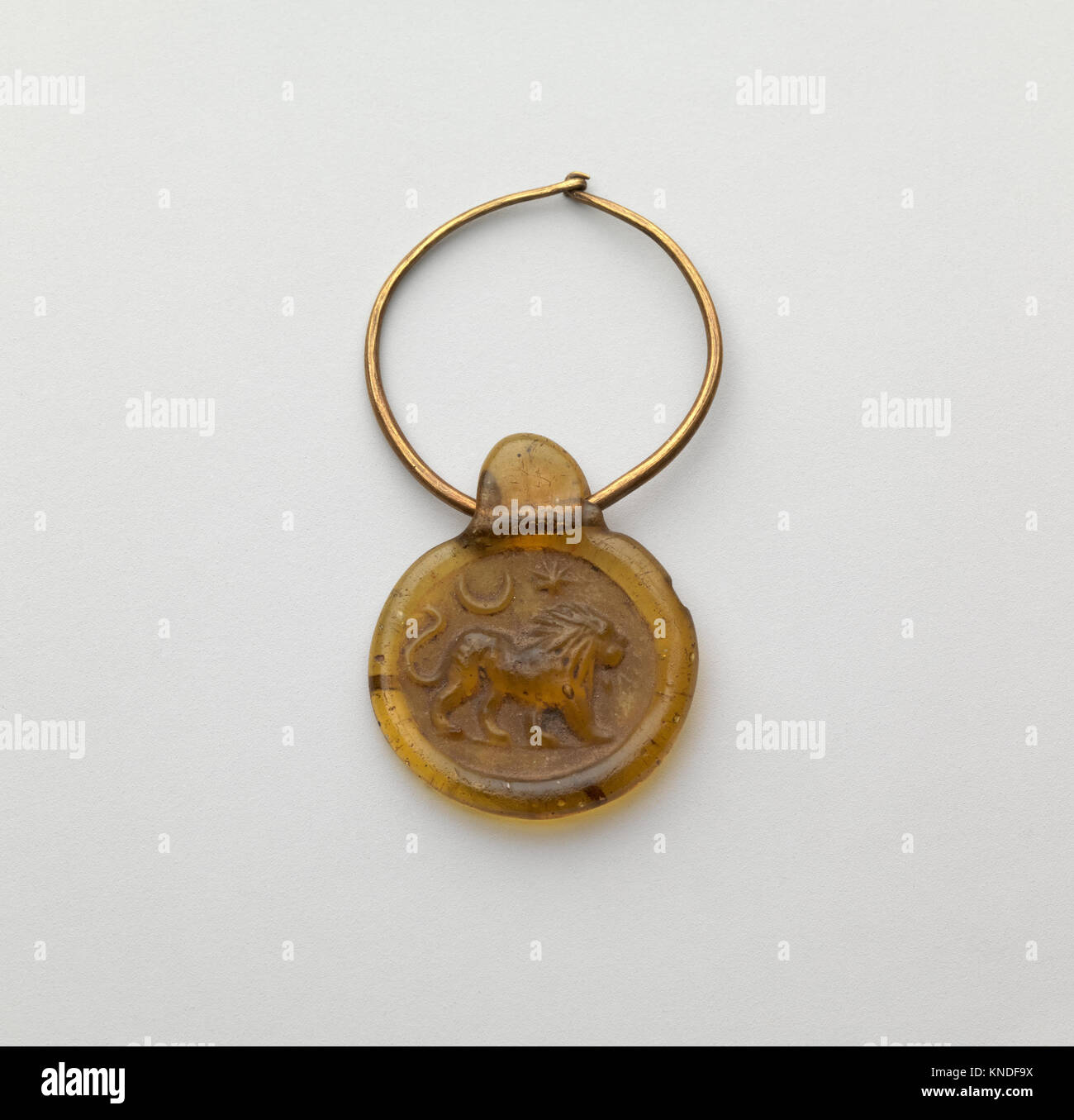 Glass stamped disk pendant hi-res stock photography and images - Alamy