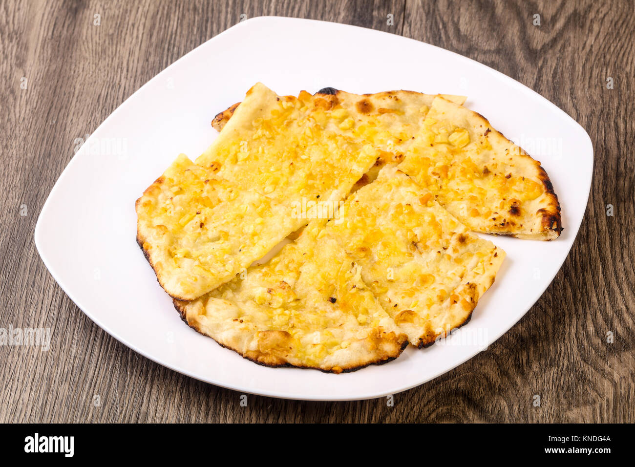 Indian bread - Naan with cheese and garlic Stock Photo - Alamy