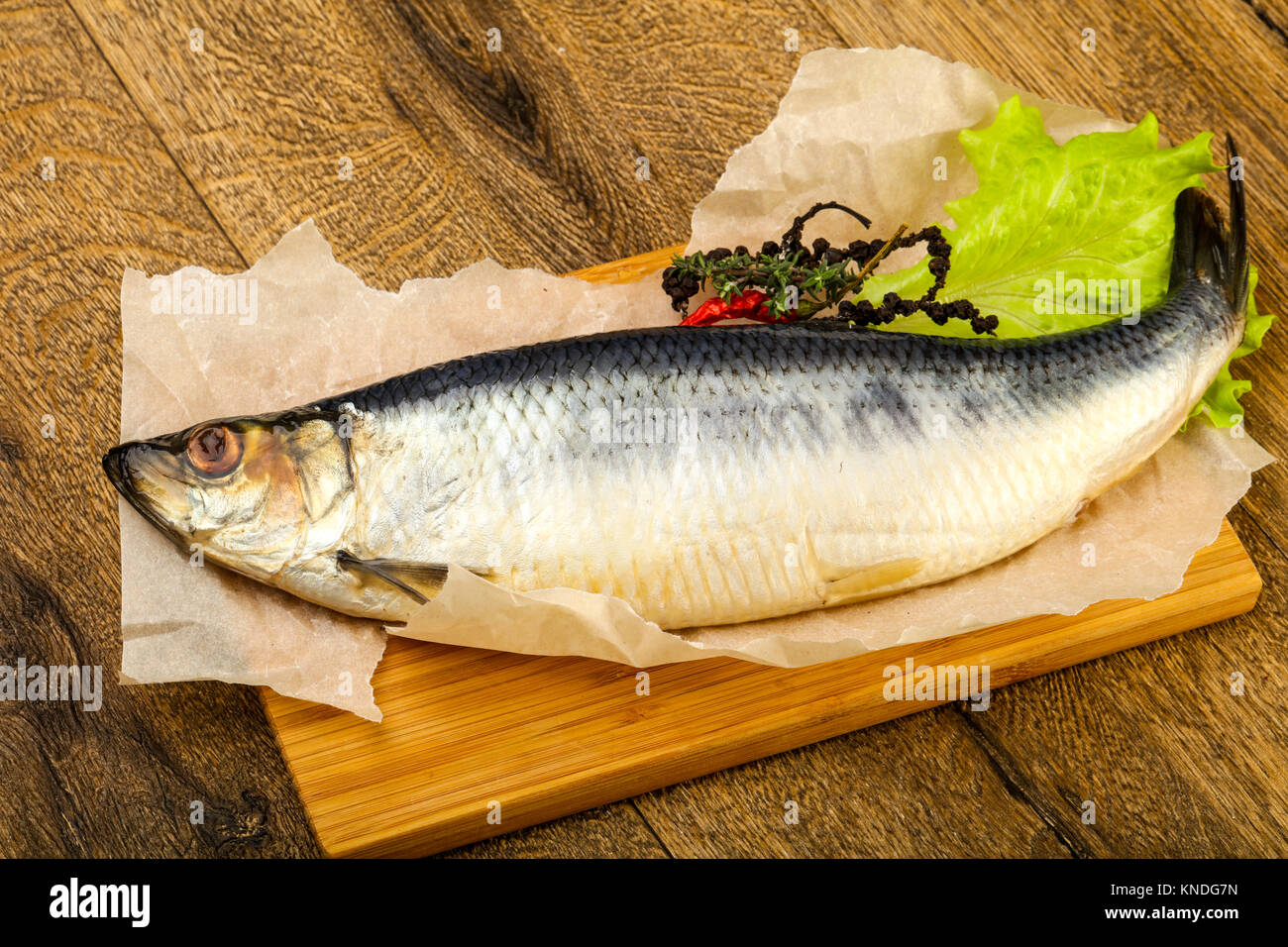 Salted Herring fish with pepper and spices Stock Photo - Alamy