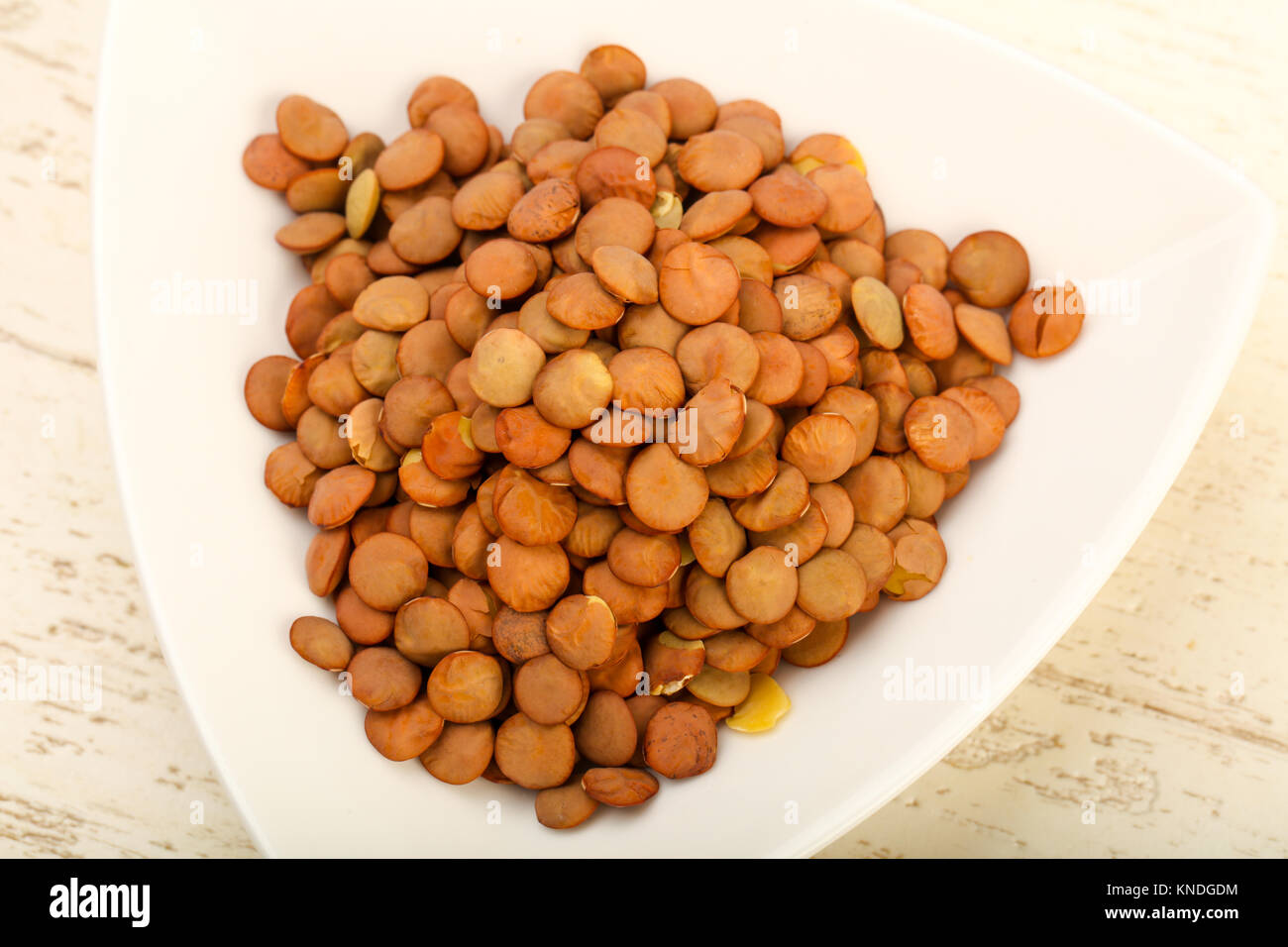 Raw lentils in the bowl ready for cooking Stock Photo - Alamy