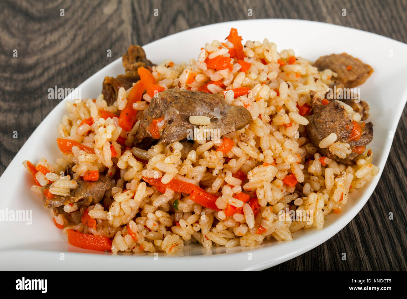 Asian rice - Plov with meat and carrot Stock Photo - Alamy