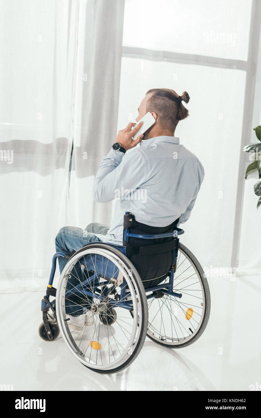 disabled man talking by phone Stock Photo - Alamy