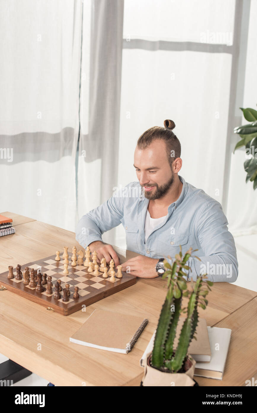 man playing chess with himself Stock Photo - Alamy