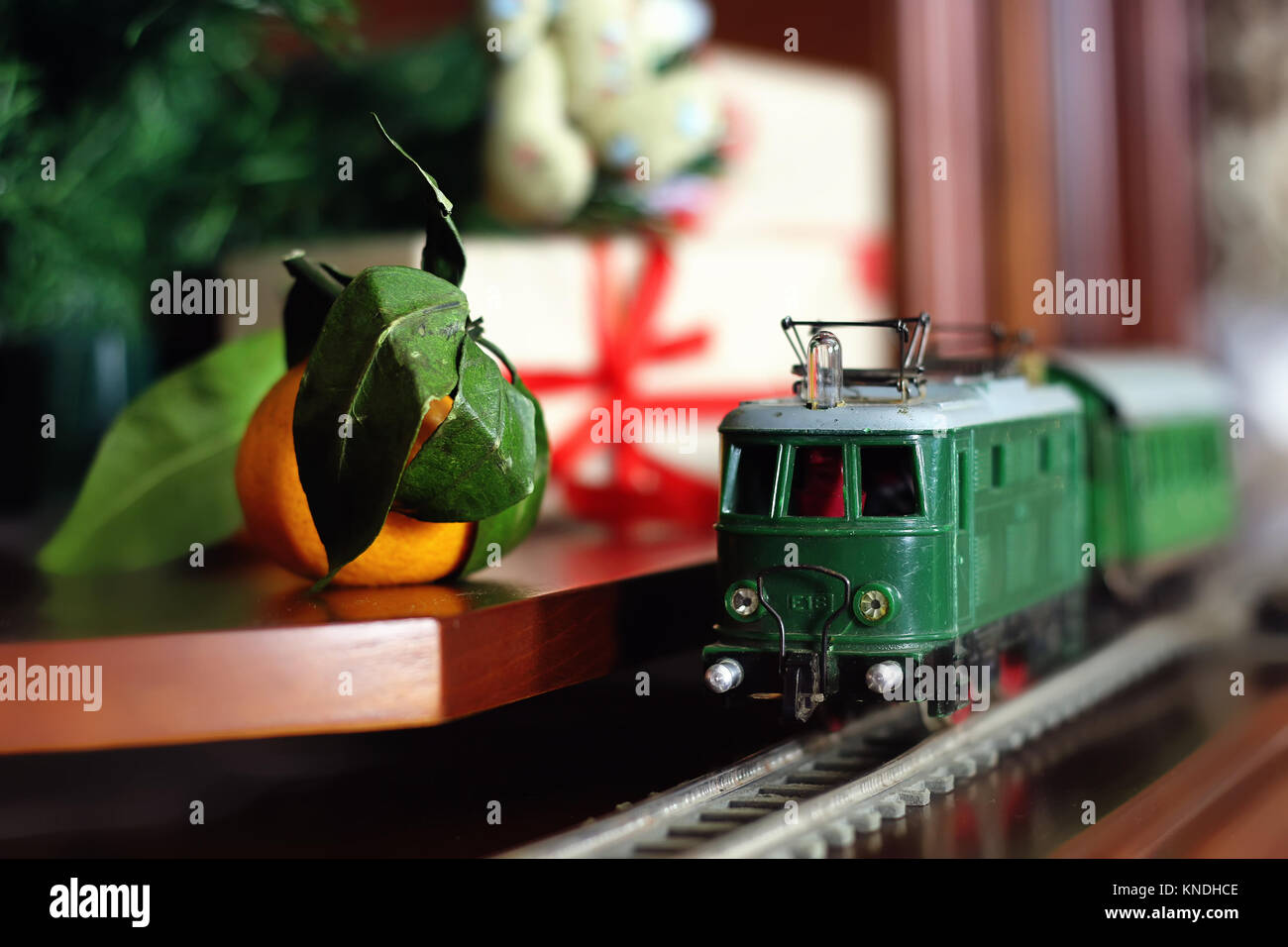 train under tree gift Stock Photo - Alamy