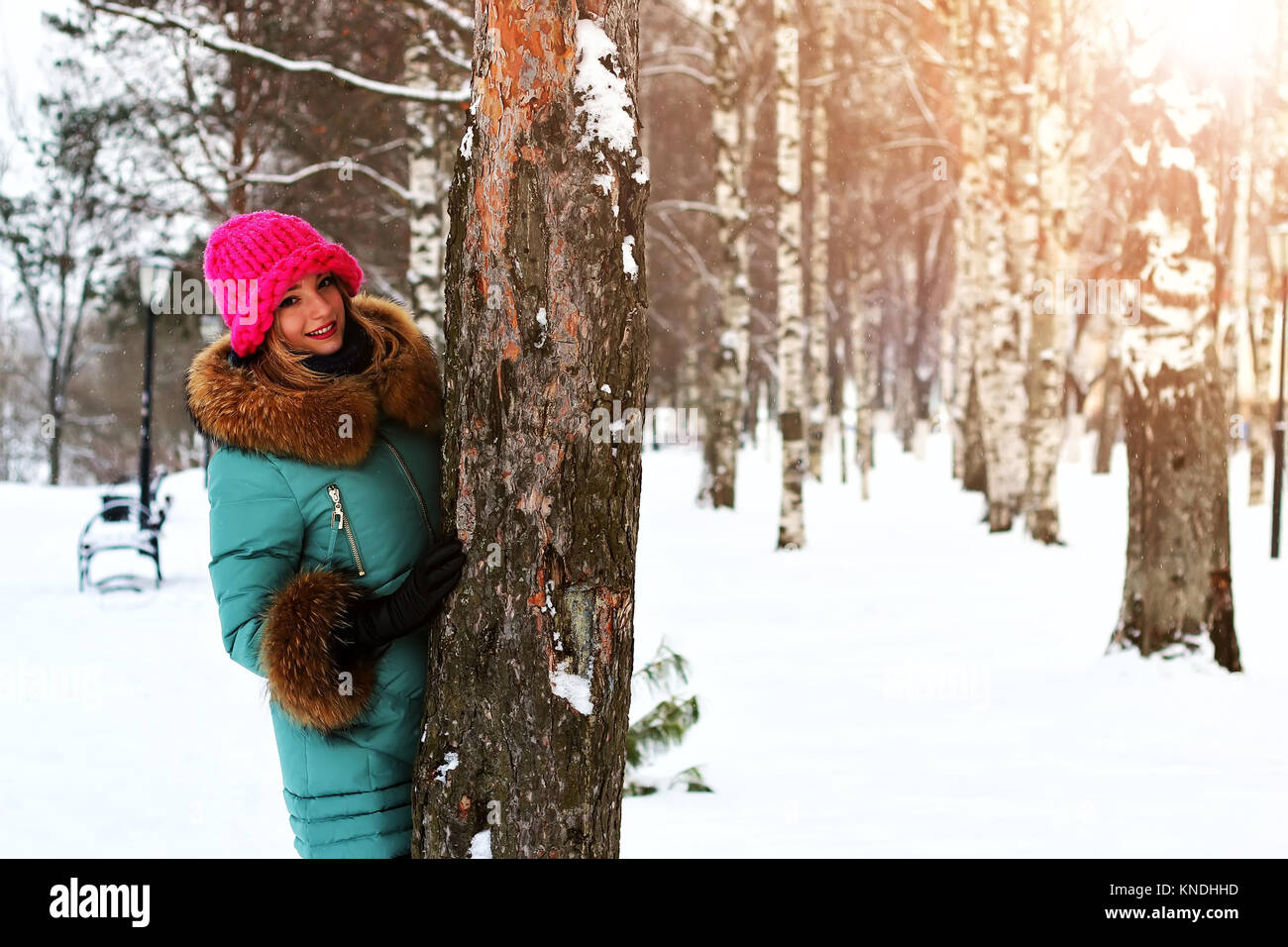 young woman tree winter Stock Photo - Alamy
