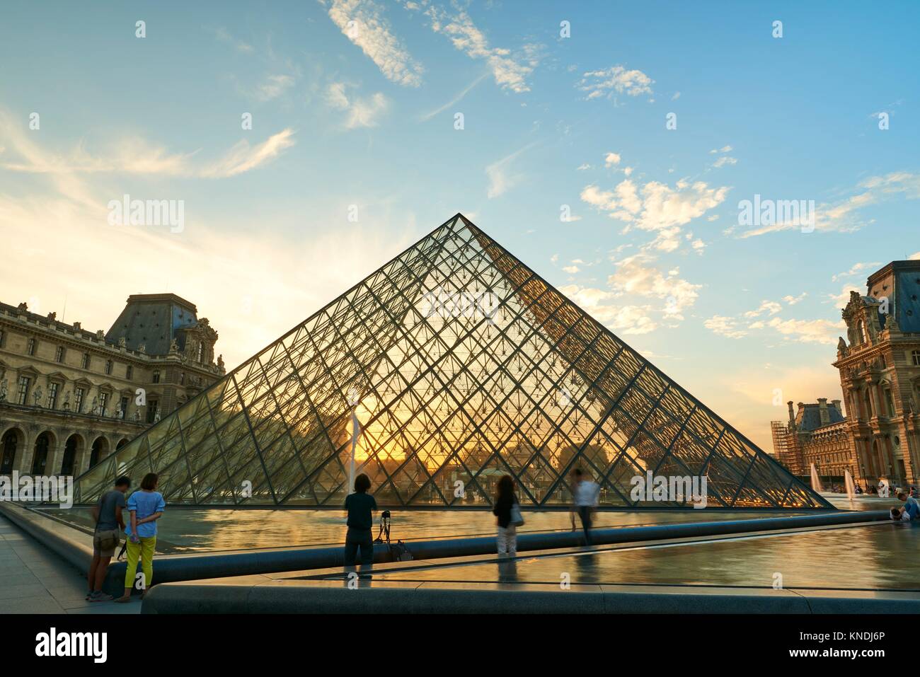Tourists visiting the famous Louvre Pyramid. Paris. France Stock Photo ...