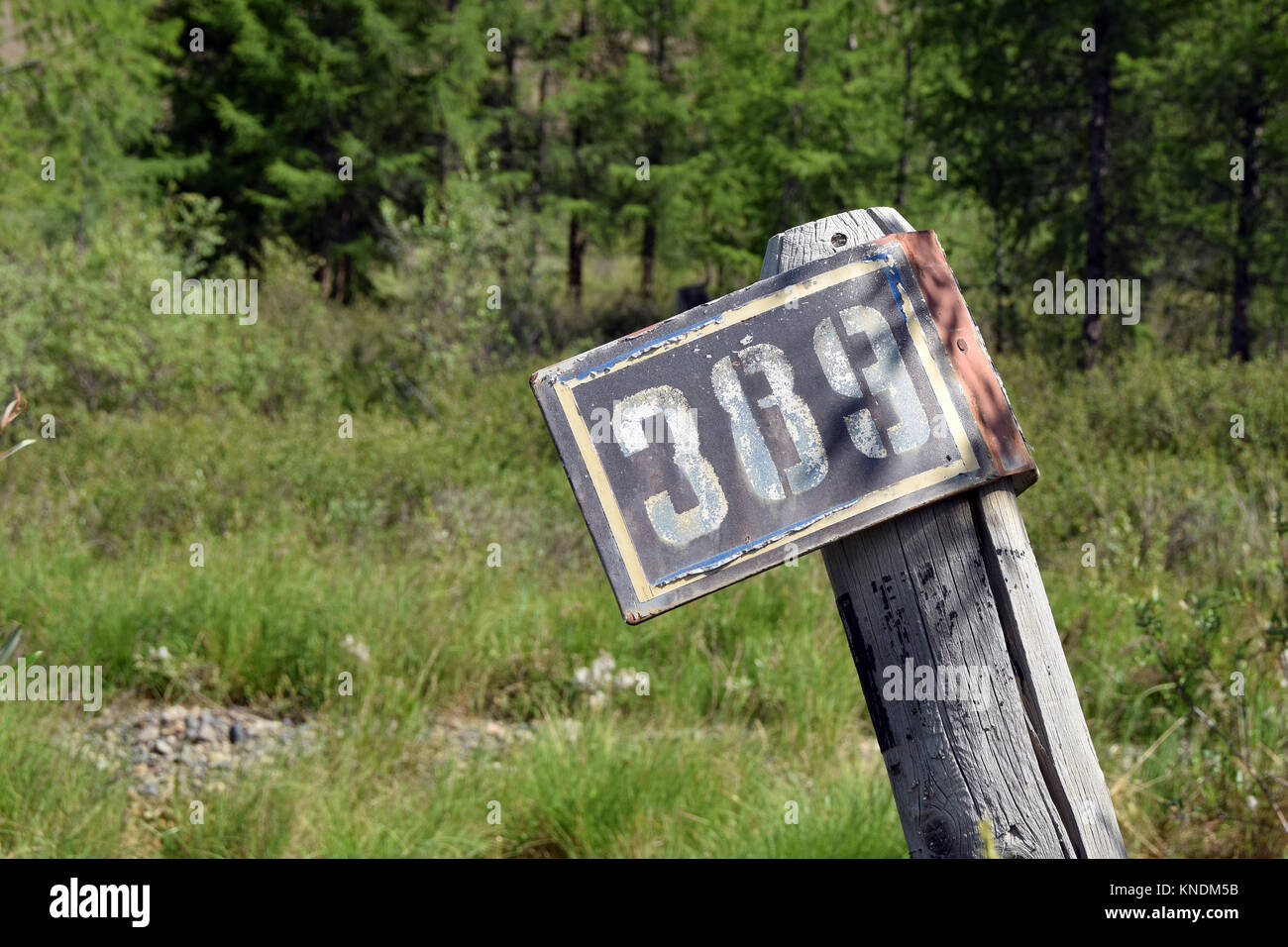 On the Kolyma highway, old road sign with mileage. This road has been ...
