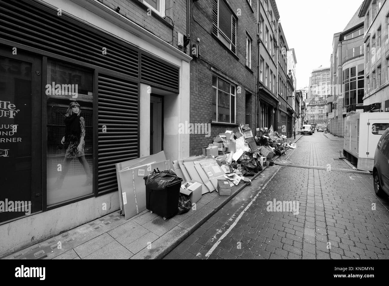 Back street of Manchester poster with woman looking back at piles of ...
