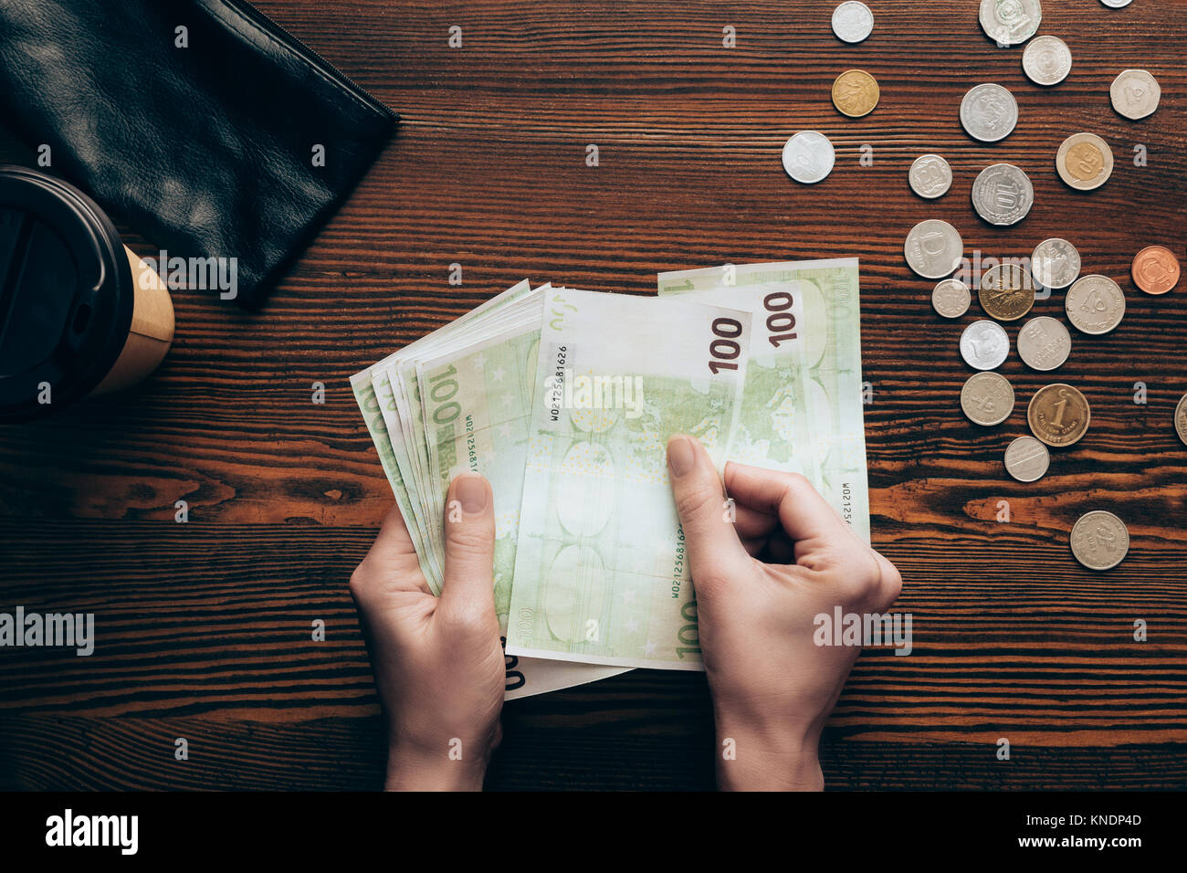 hands with banknotes and coins Stock Photo - Alamy