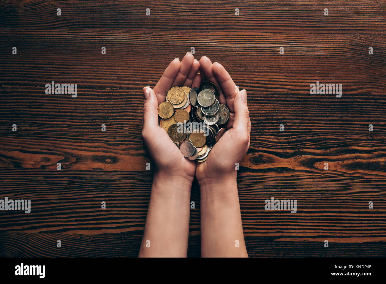 Hands paying coins hi-res stock photography and images - Alamy