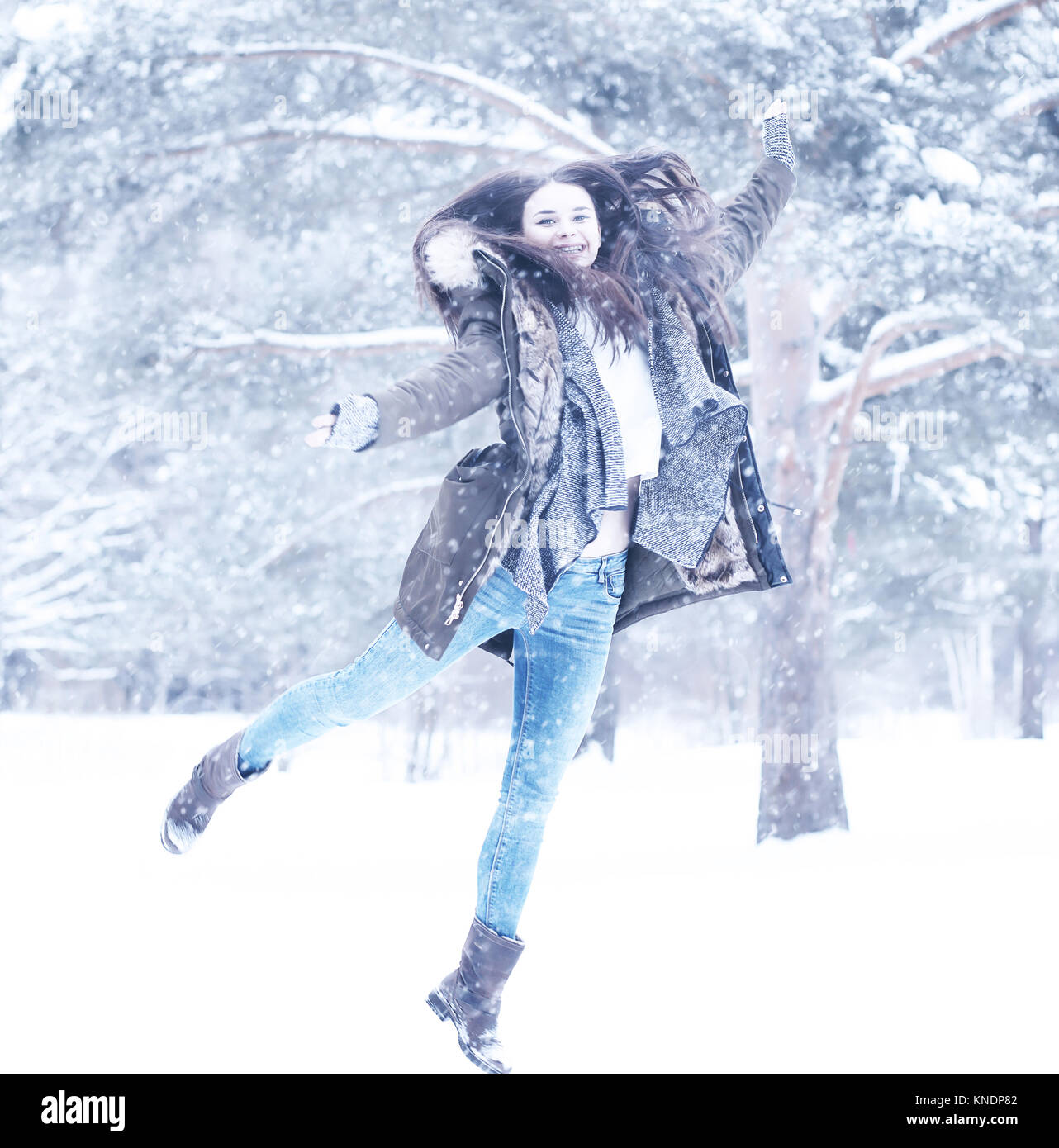 Beautiful girl in a beautiful winter snow Stock Photo - Alamy